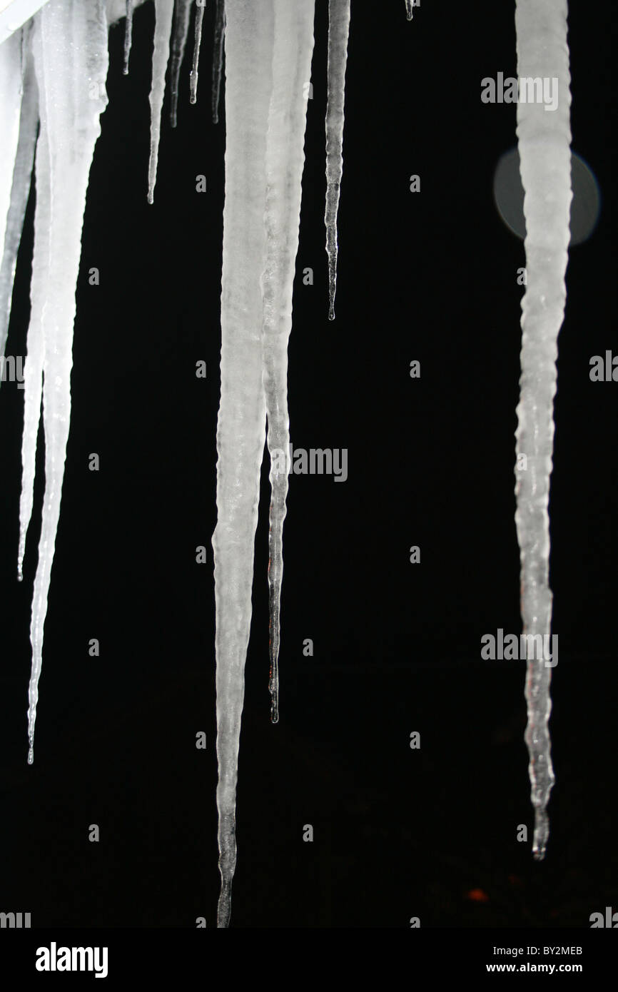 Icicles in the night Stock Photo - Alamy