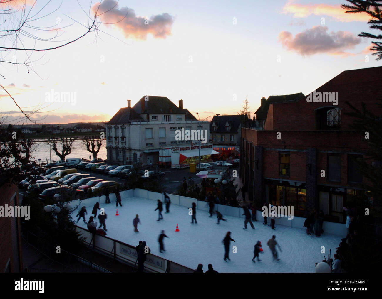 Ice skaters enjoy a winter evening in Gien, France Stock Photo - Alamy
