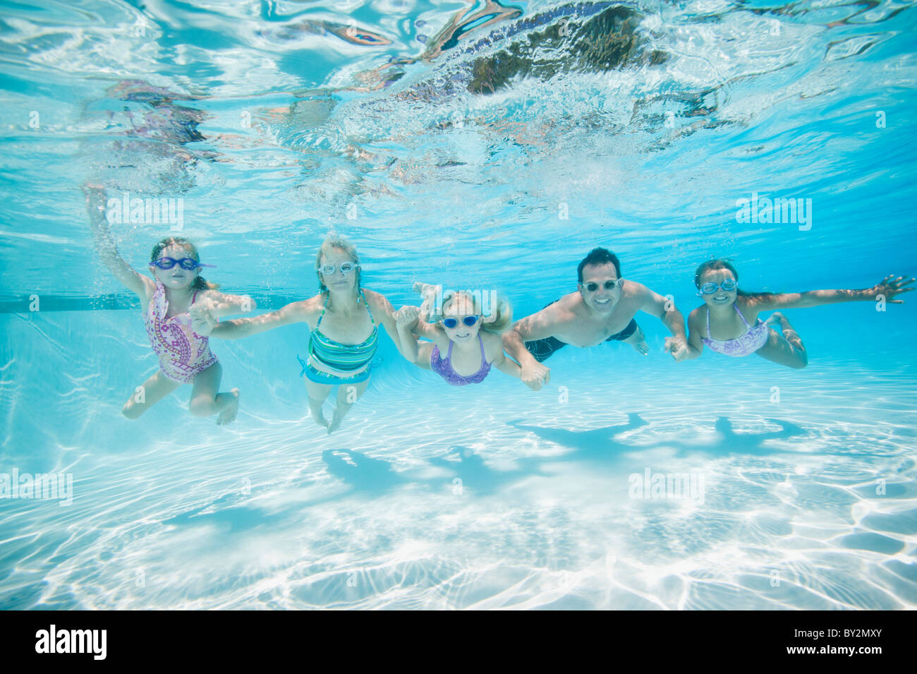 Three people diving hi-res stock photography and images - Alamy