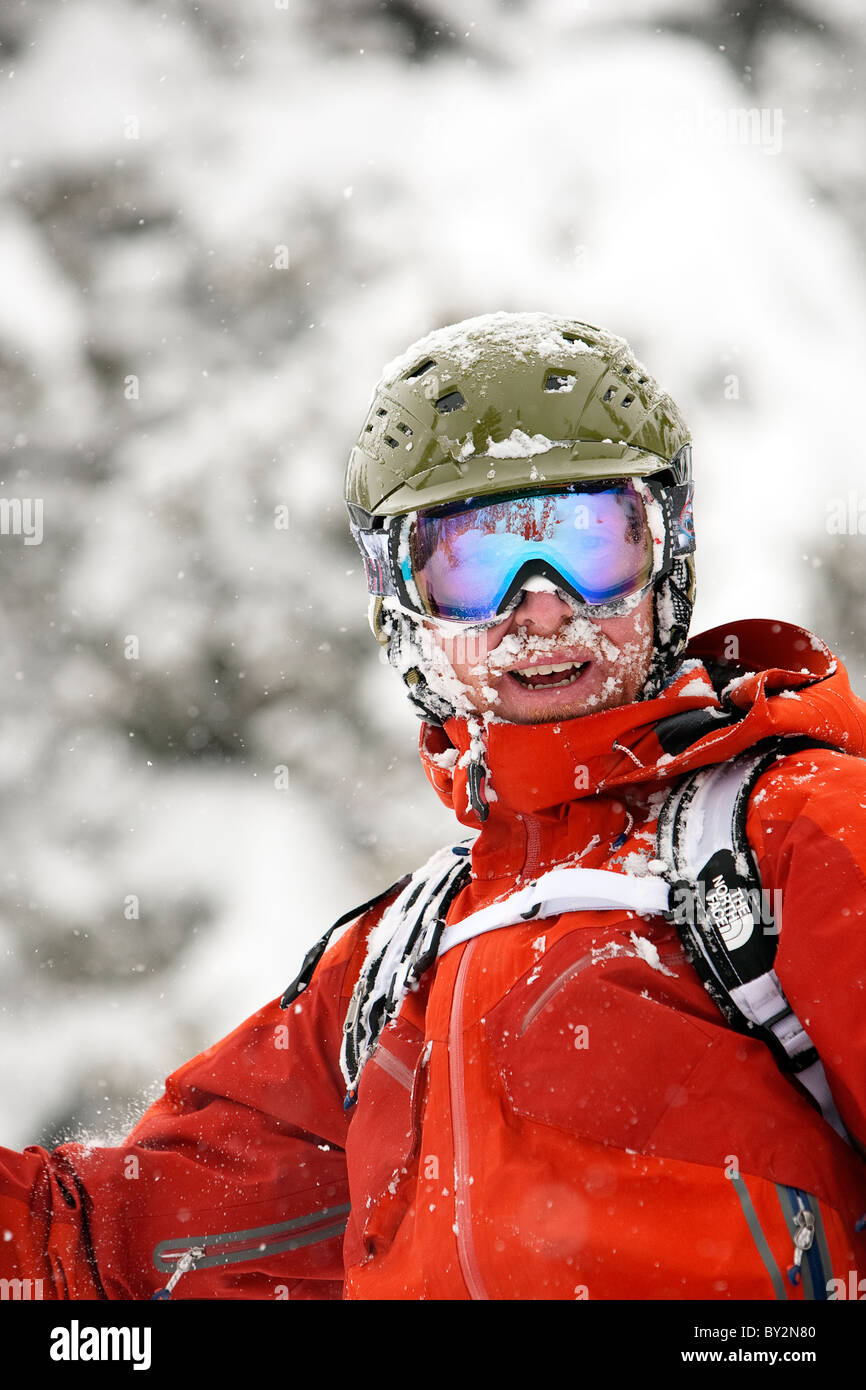 A professional big mountain skier, catches his breath after falling in ...