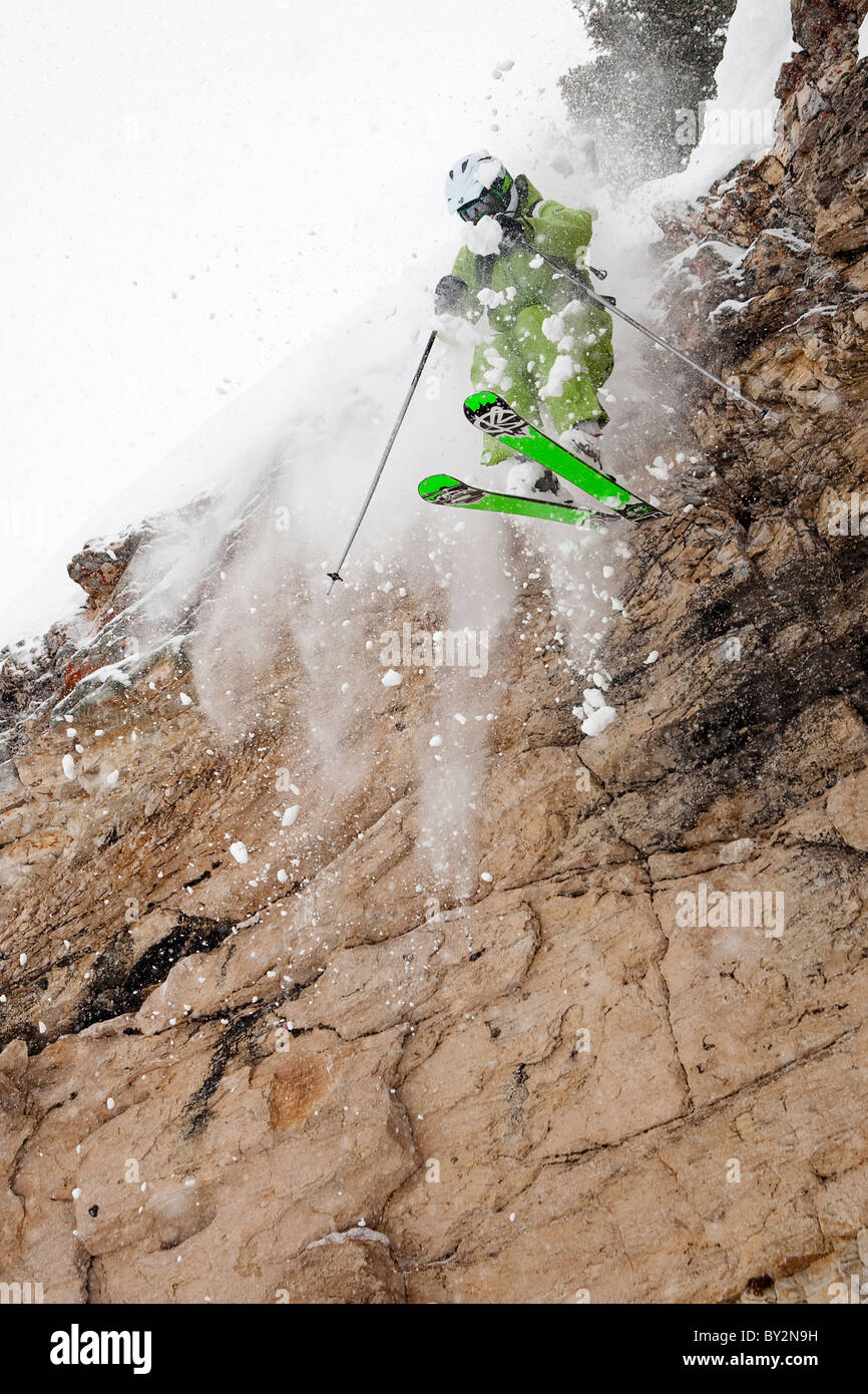 A male skier jumps off of a large cliff at Alta ski area, Utah Stock ...