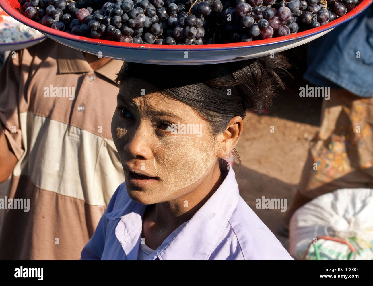 Burmese woman vendor selling grapes in Kyaukme, Shan State, Myanmar ...