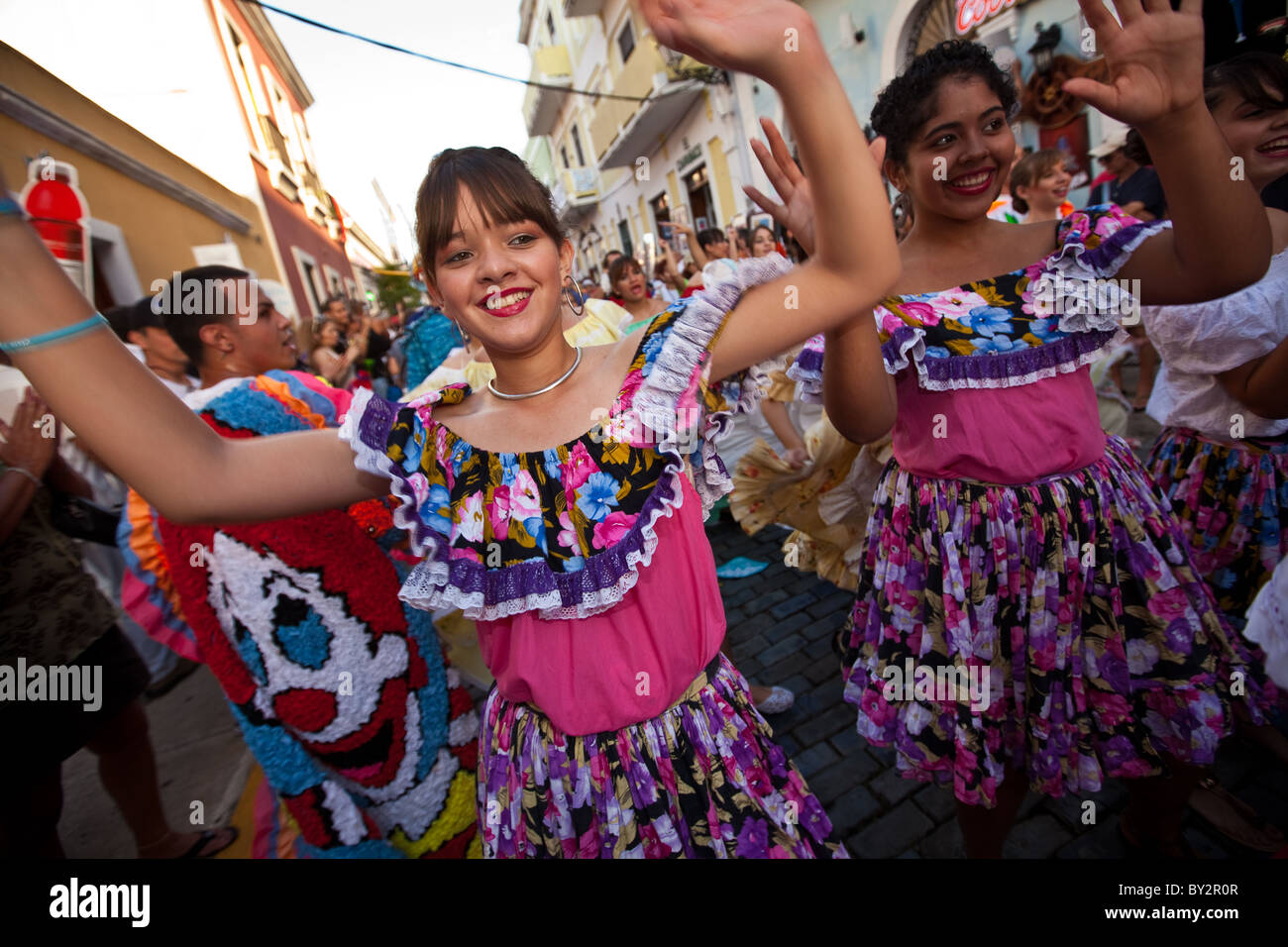 Traditional dancers parade through the streets of Old San Juan during ...
