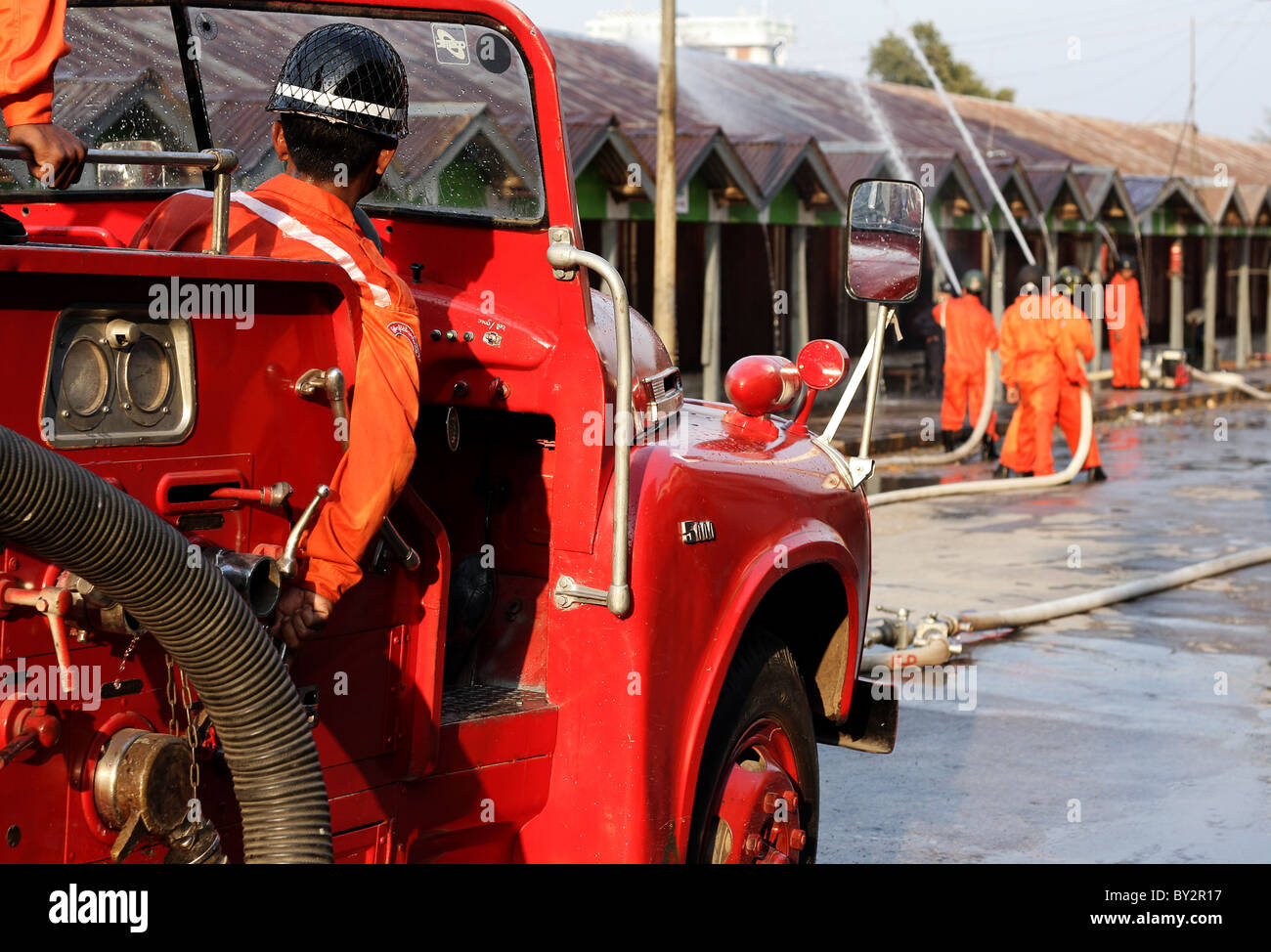 Primitive burmese fire engine and firefighters in the small Shan town ...