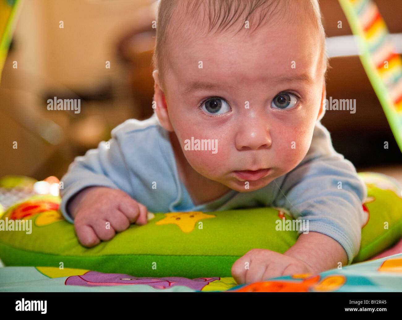 A Baby Laying on the mat Stock Photo - Alamy