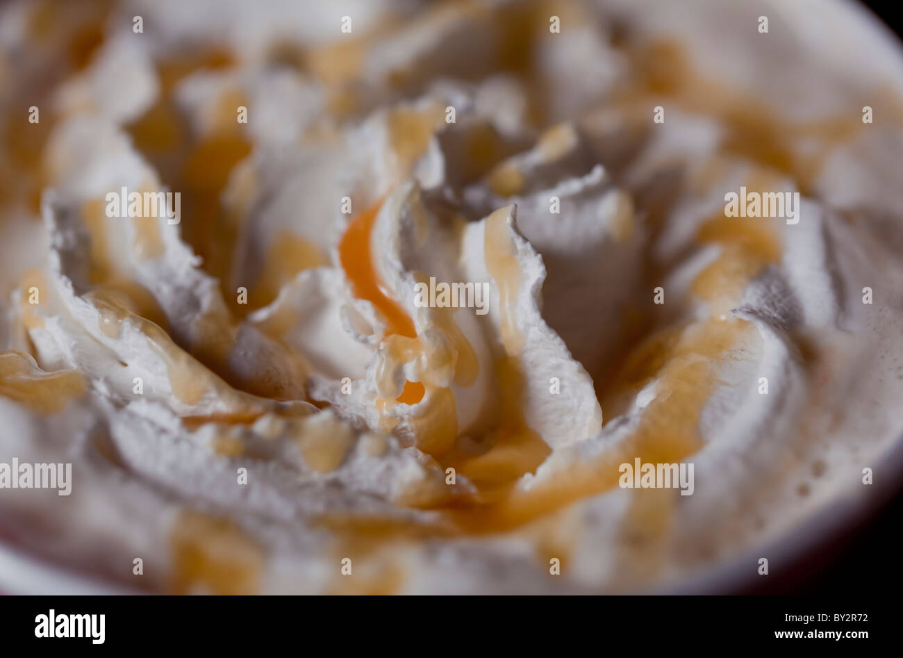Yummy whipped cream with caramel syrup and a coffee cup Stock Photo - Alamy