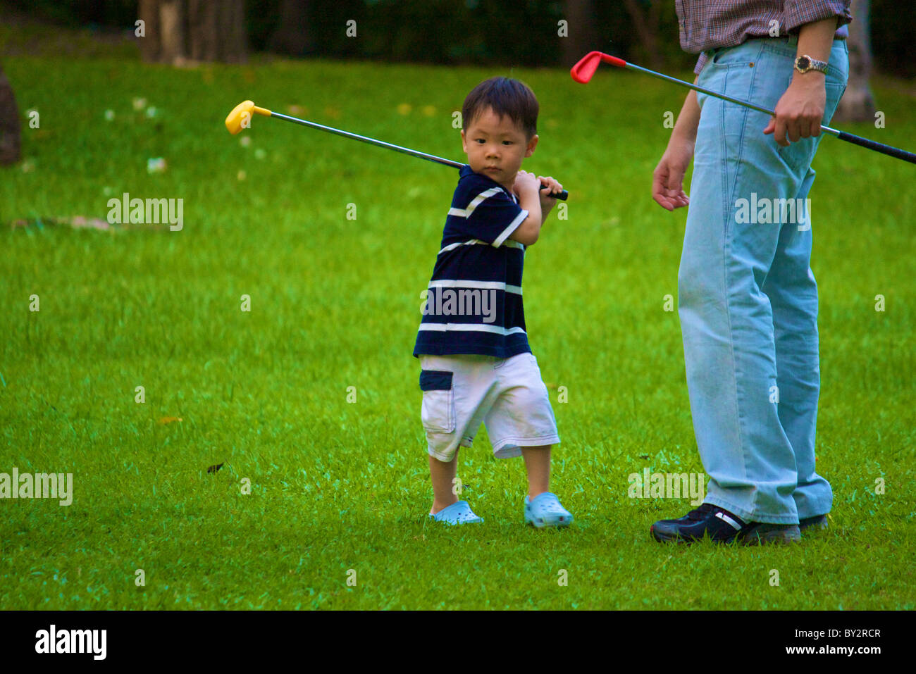Child golf swing hi-res stock photography and images - Alamy