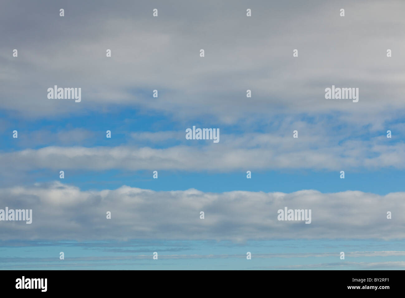 Great layered clouds floating in the sky above Stock Photo - Alamy