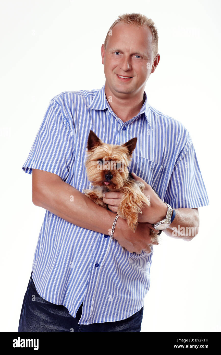 Man holding a dog Stock Photo - Alamy