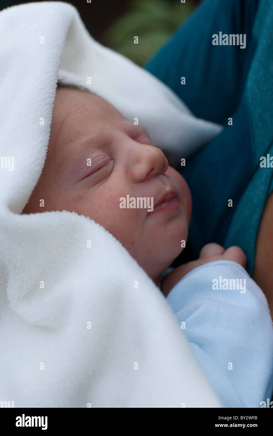 Newborn baby wrapped in a blanket Stock Photo - Alamy
