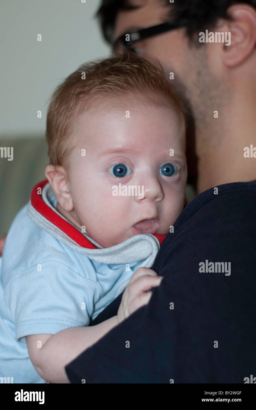 8 week old baby being winded by dad Stock Photo - Alamy