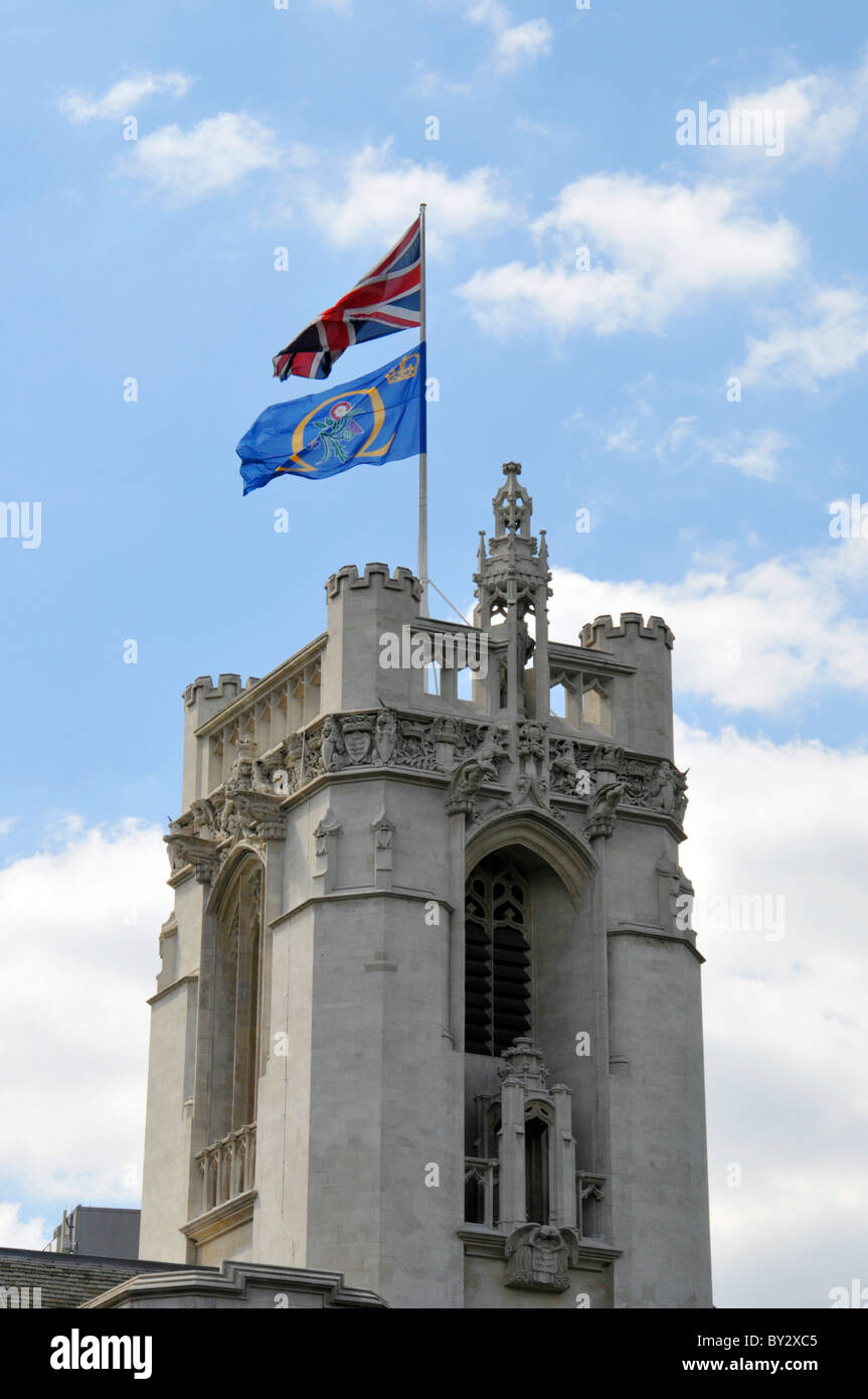 Union Jack & Emblem UKSC flags flying above stone tower old Middlesex ...