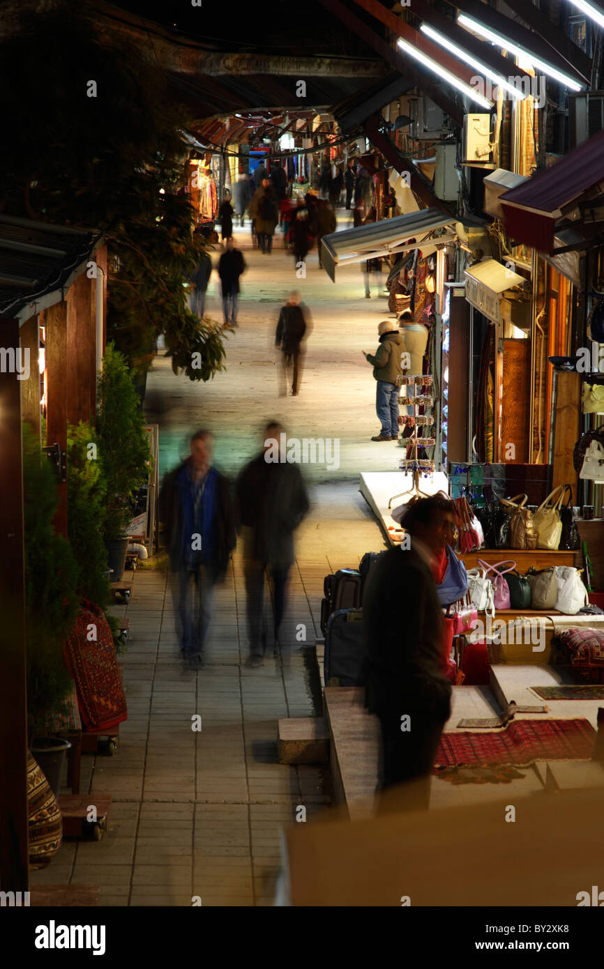 Night scene in a bazaar near the Blue Mosque in Istanbul with people ...