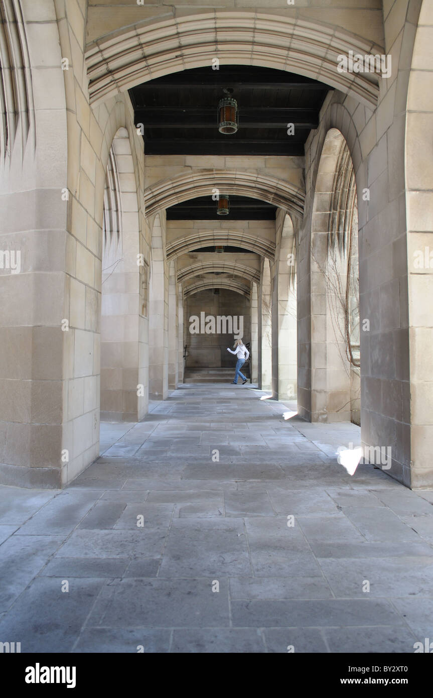 A little girl runs through an archway in an old building Stock Photo ...