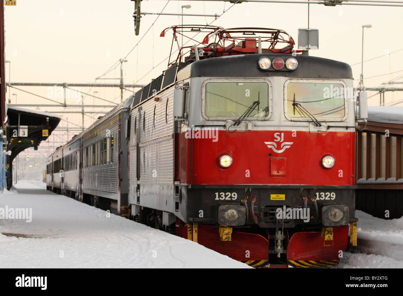 Swedish passenger train in a station on a winter day Stock Photo - Alamy