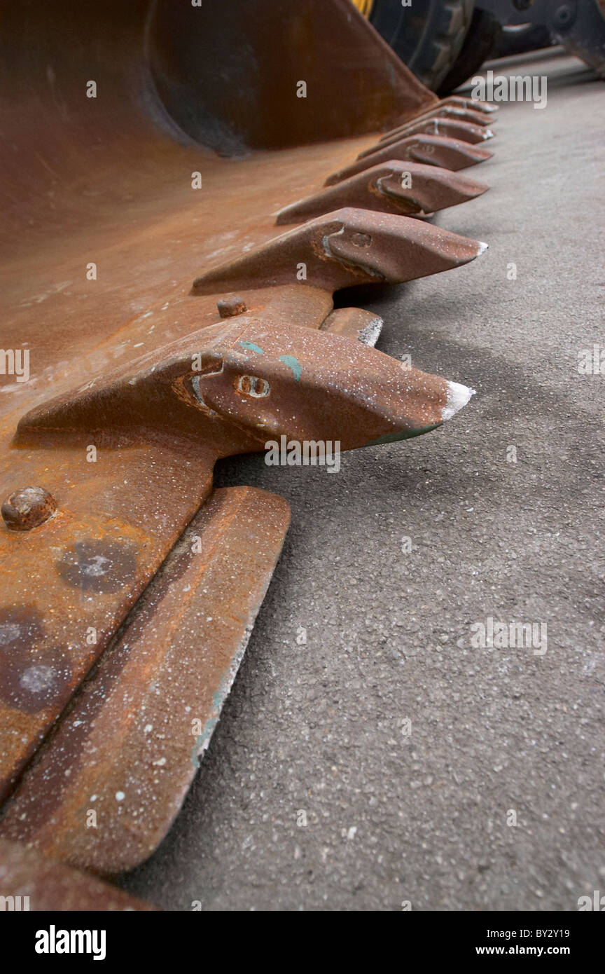 Rusty front loader bucket detail Stock Photo - Alamy