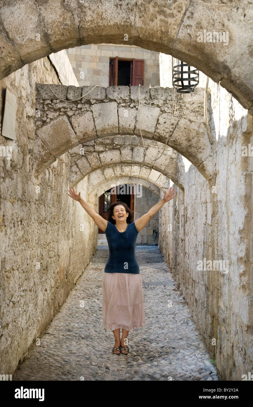 Happpy, welcoming Greek woman in her home town of Rhodes, Greece Stock ...
