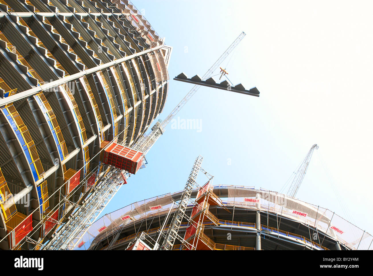 Steel frame construction. A lift platform is visible on the side of the ...