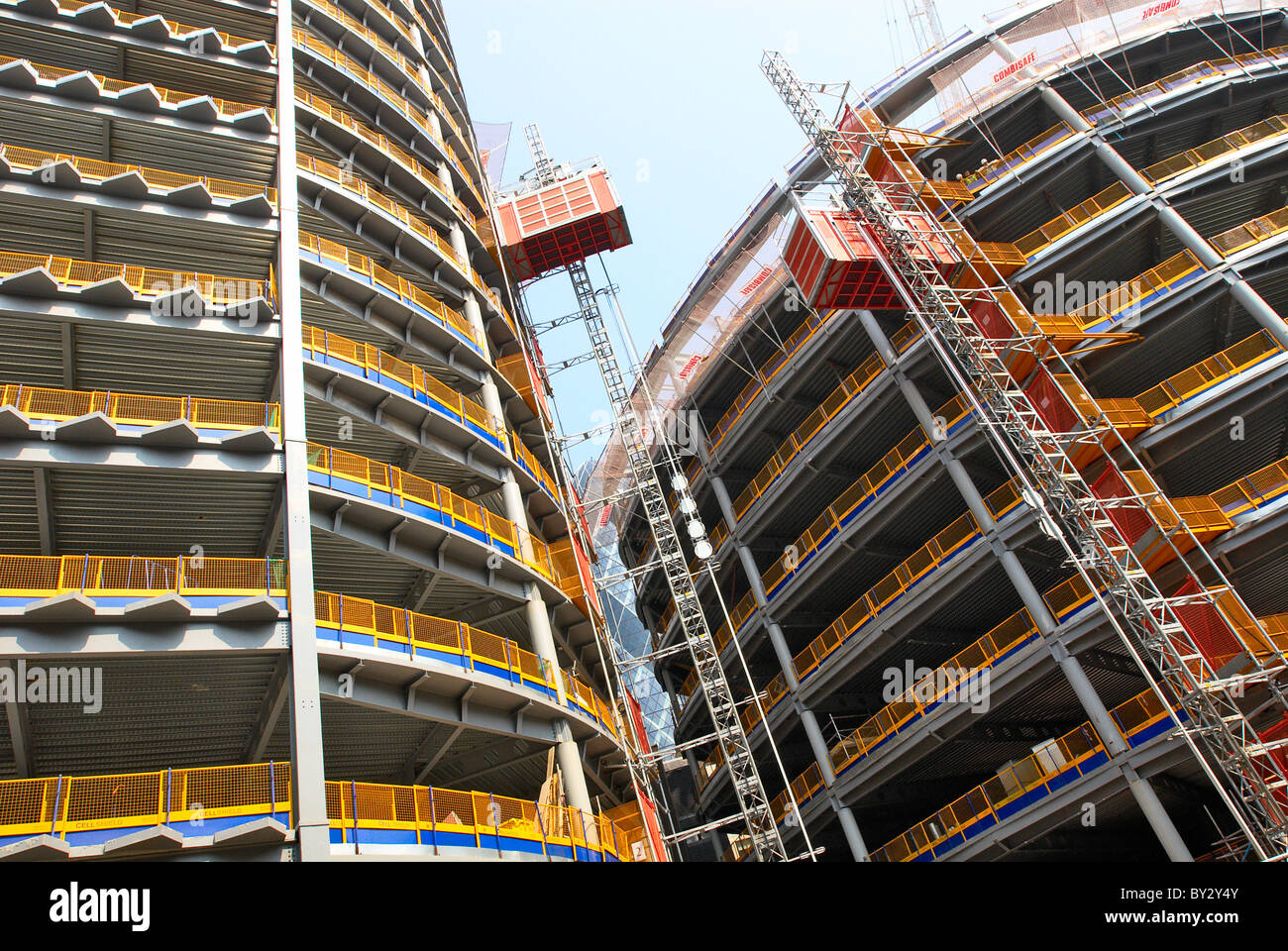 Steel frame construction. A lift platform is visible on the side of the ...