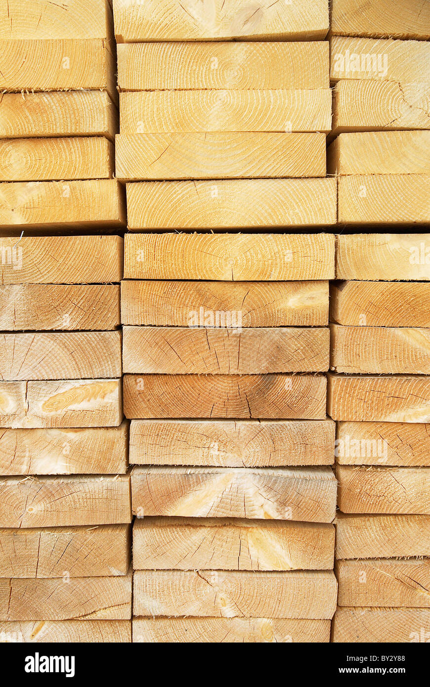Stacked wood in timber's merchant warehouse Stock Photo - Alamy