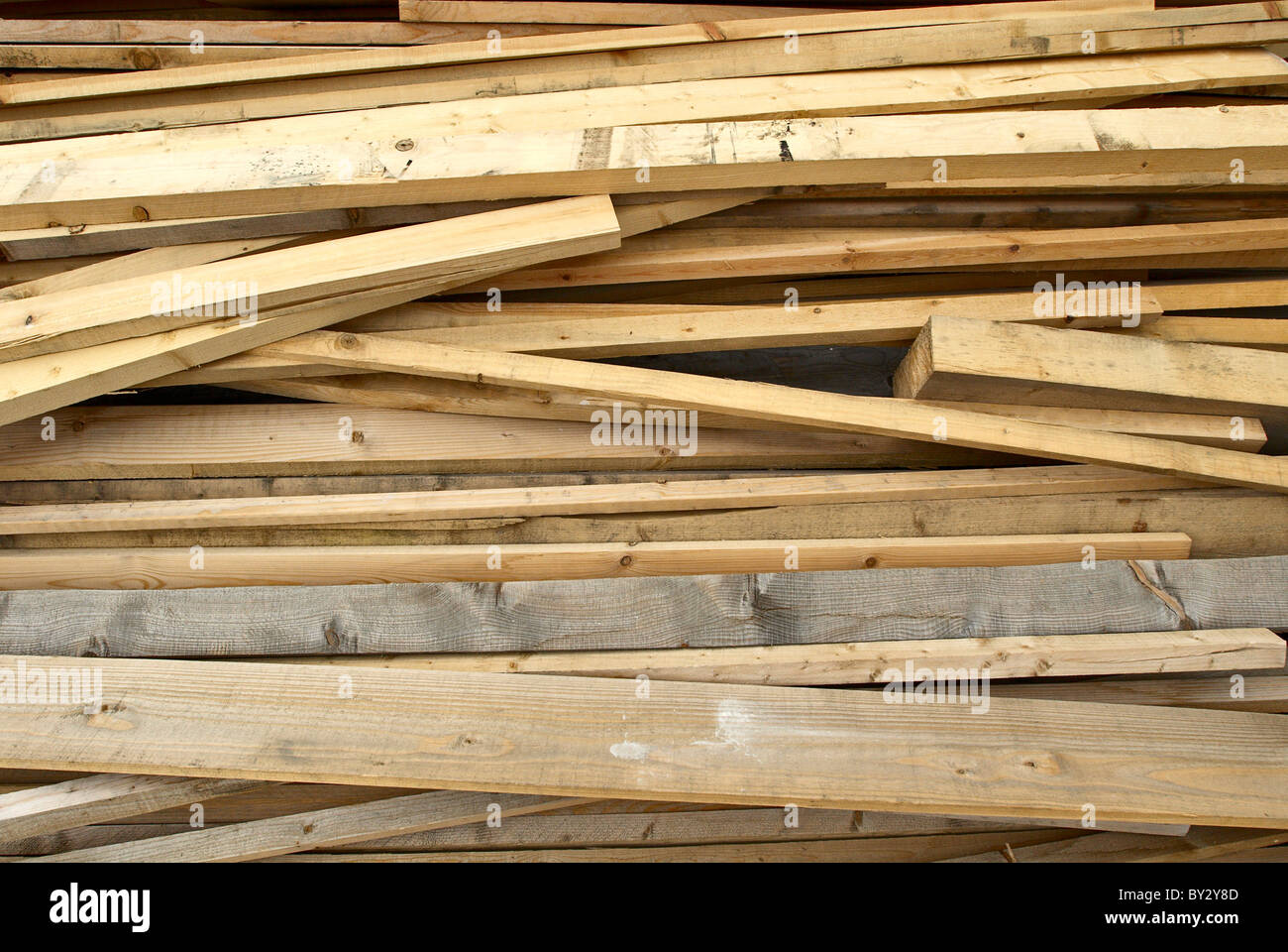 Stacked wood in timber's merchant warehouse Stock Photo - Alamy