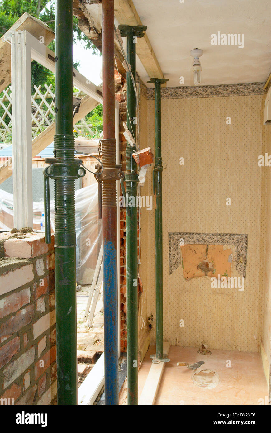 Acrow props supporting building Stock Photo - Alamy