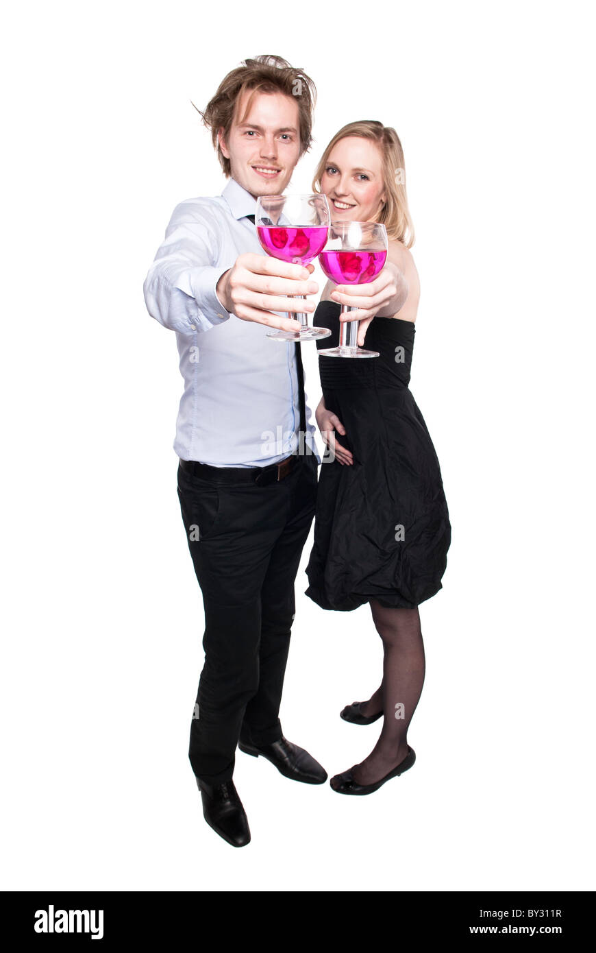 Young couple toasting with pink drink. Two people drinking. Studio ...