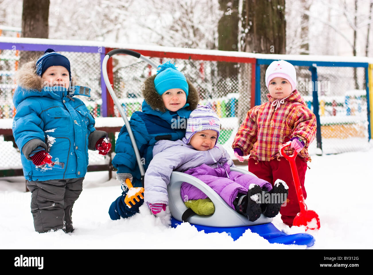 Children playing in snow outdoor in winter Stock Photo - Alamy