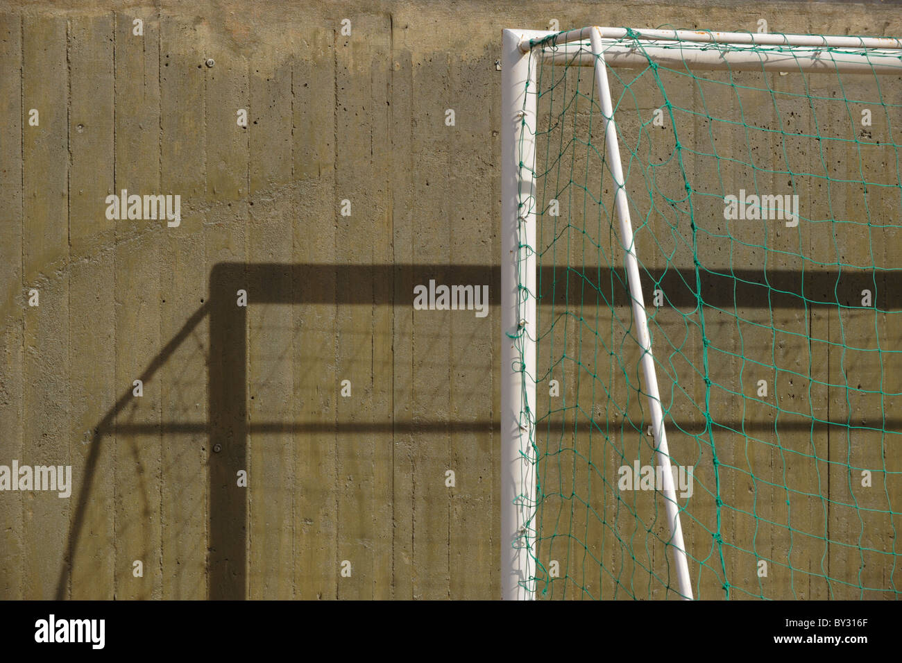 Football goal post and shadow Stock Photo - Alamy