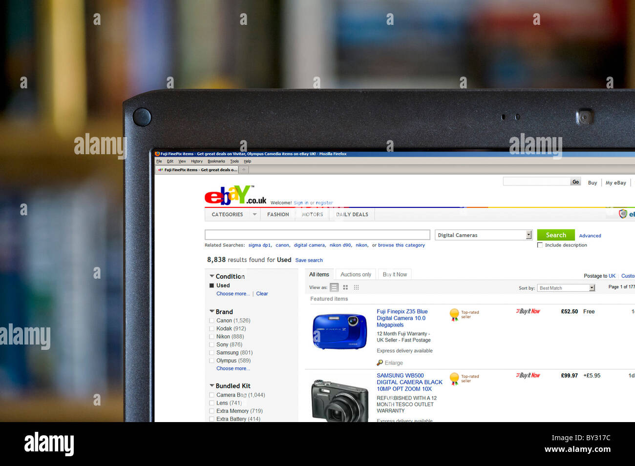 Browsing digital cameras for sale on ebay.co.uk on a Laptop Computer ...