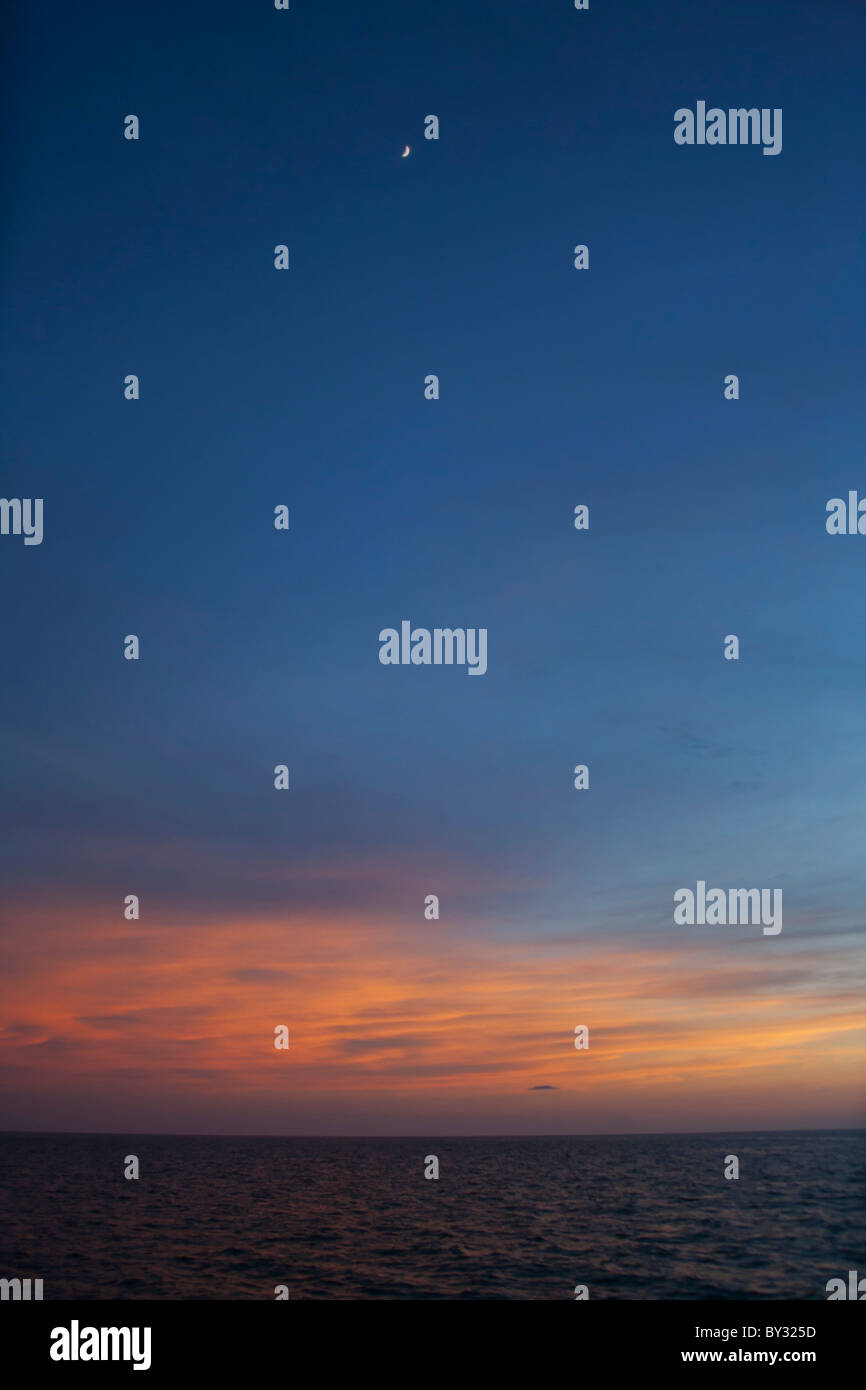 Sunset and crescent moon at Clearwater, FL Stock Photo - Alamy