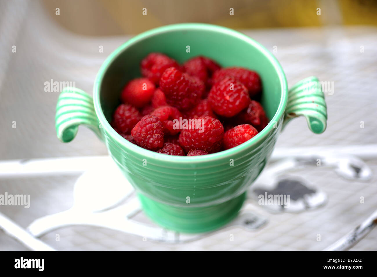 raspberry in ancient cup Stock Photo - Alamy