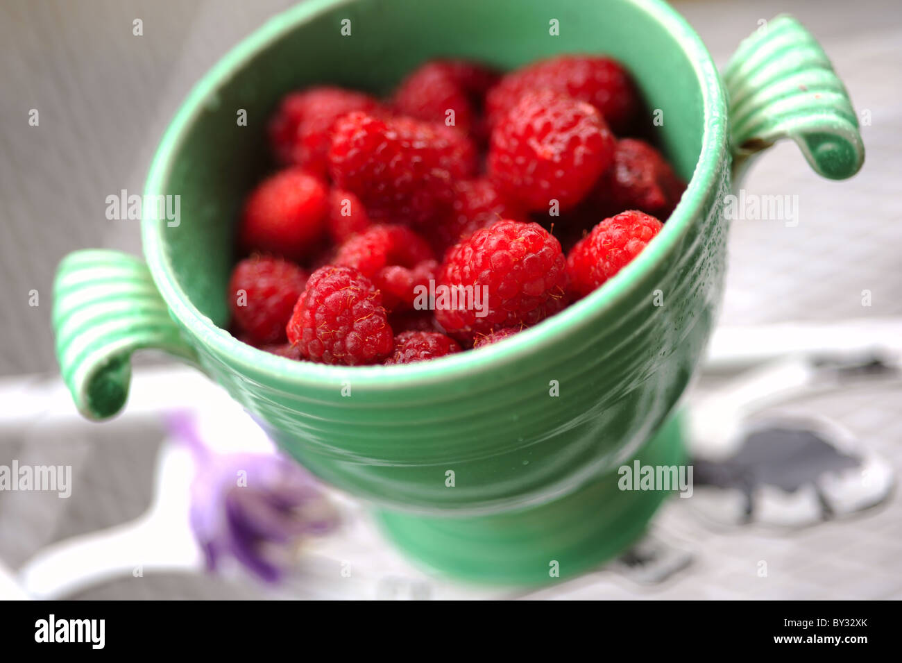raspberry in ancient cup Stock Photo - Alamy