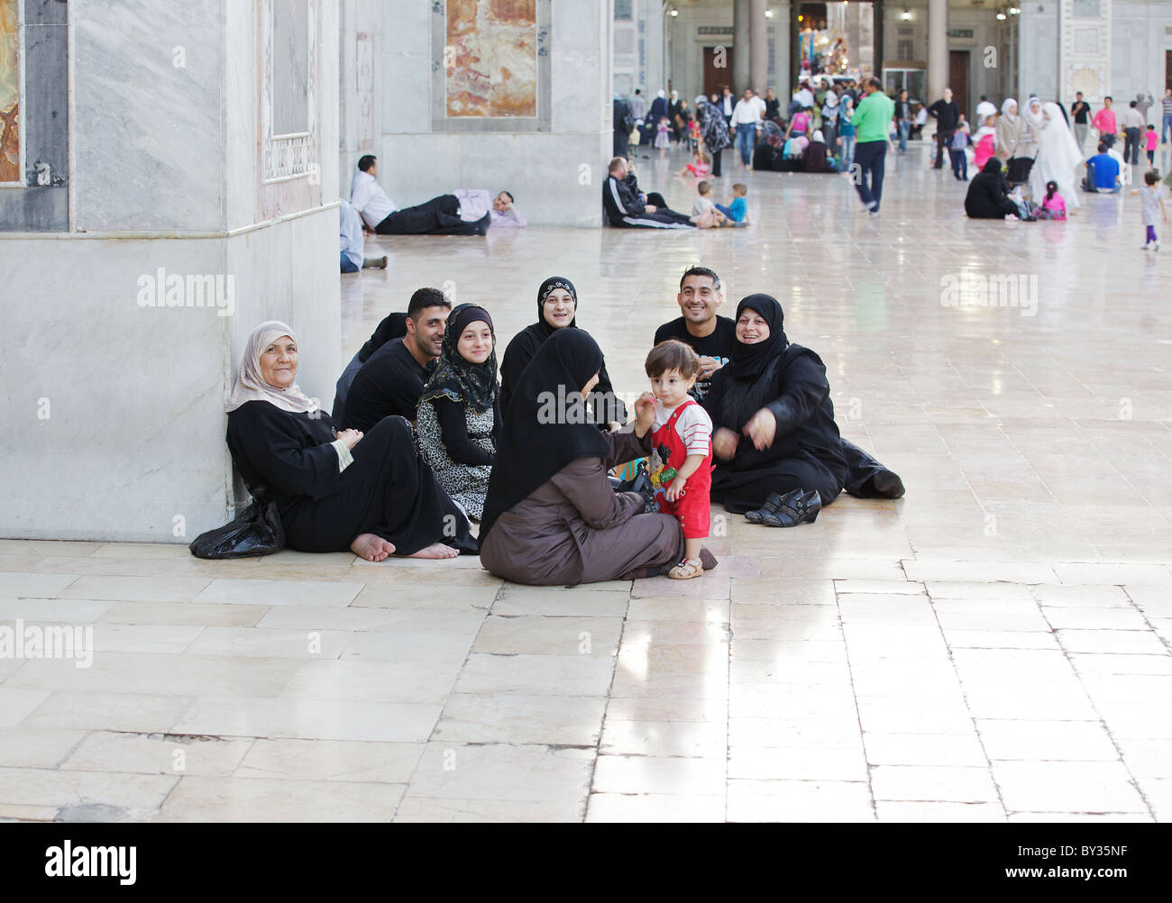Syrian family relaxing in Great Umayyad Mosque, Damascus, Syria Stock ...