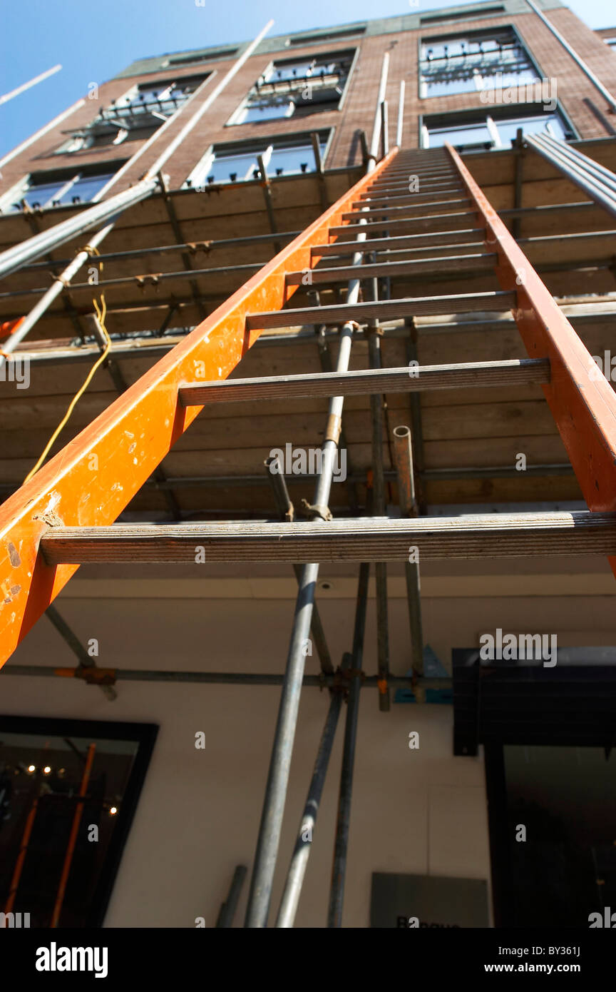 View looking up a ladder fastened to scaffolding Stock Photo - Alamy