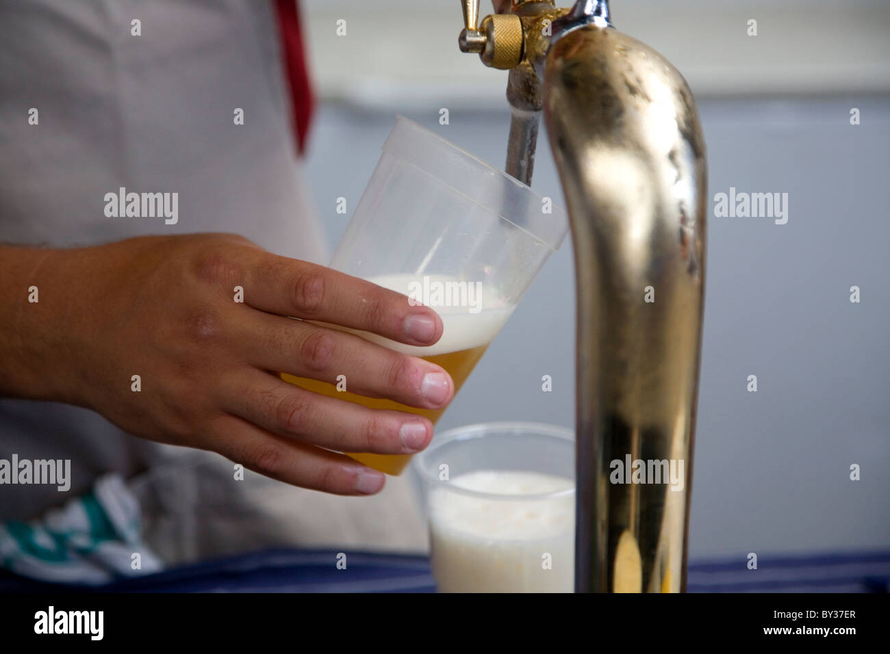 Man pulling a pint at the Old Biscuit Mill - Woodstock - Cape Town ...