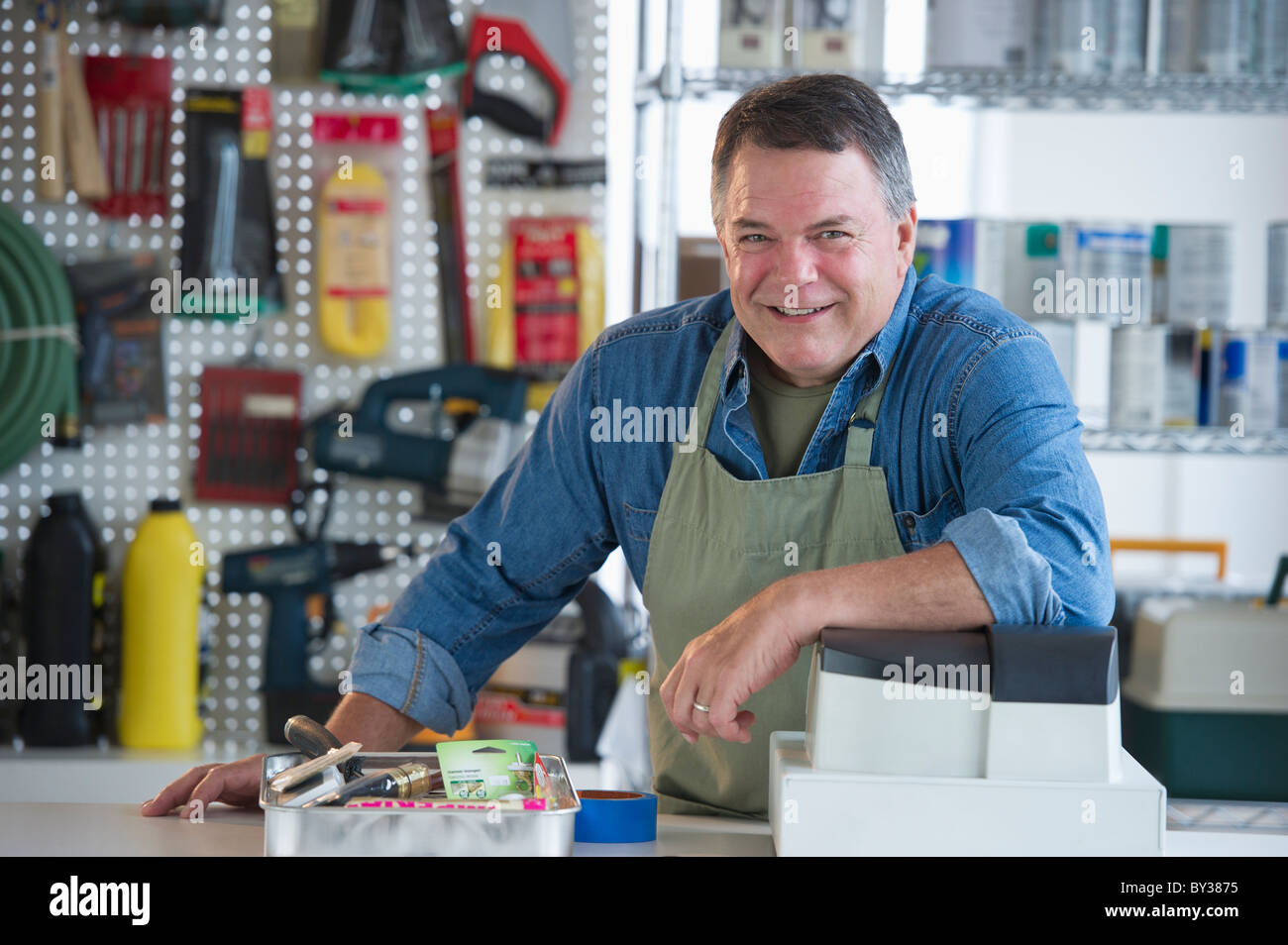 USA, New Jersey, Jersey City, Portrait of hardware shop owner at ...