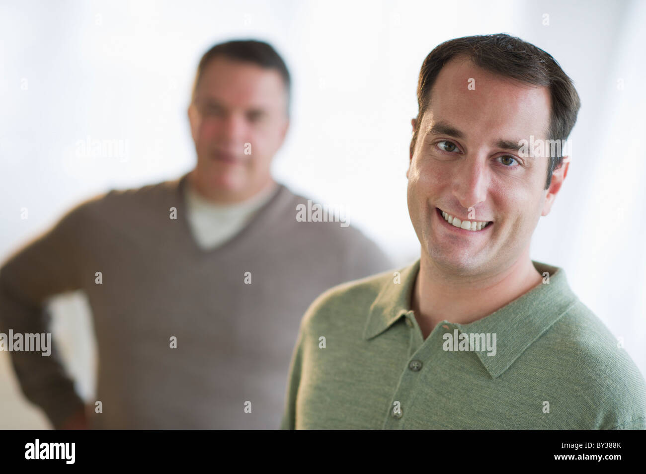 USA, New Jersey, Jersey City, Portrait of man with father in background ...
