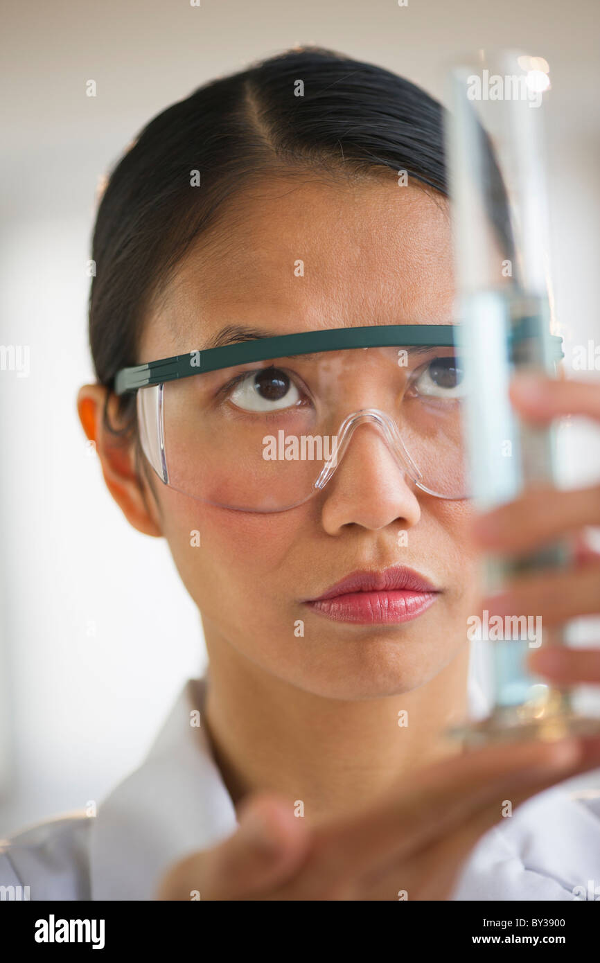 USA, New Jersey, Jersey City, Female scientist holding chemical test ...