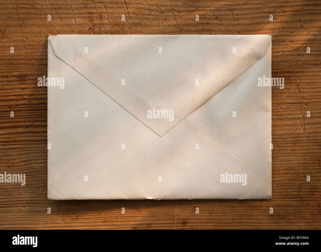 Blank envelope on wooden table Stock Photo - Alamy
