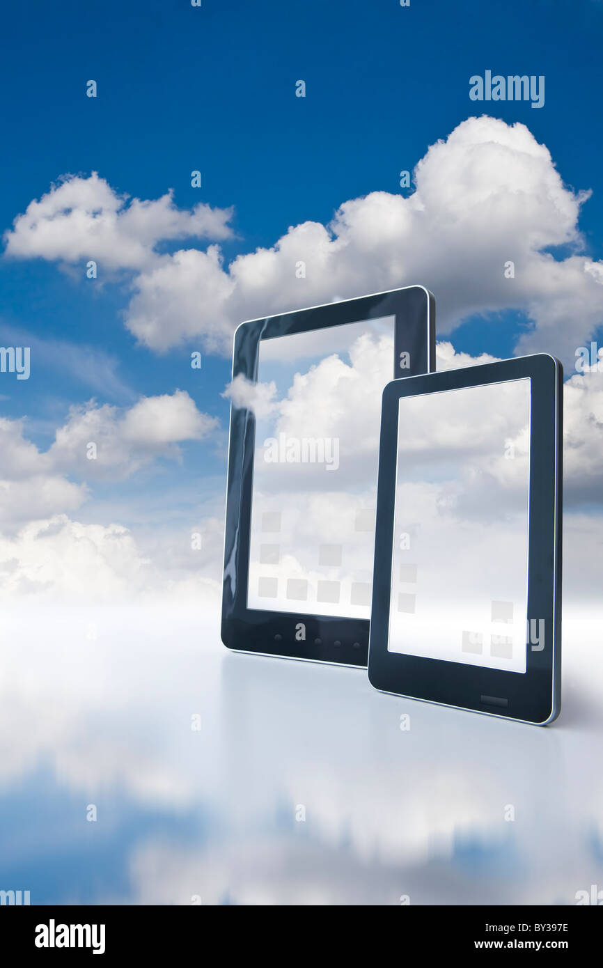 Two digital tablets floating in clouds Stock Photo - Alamy