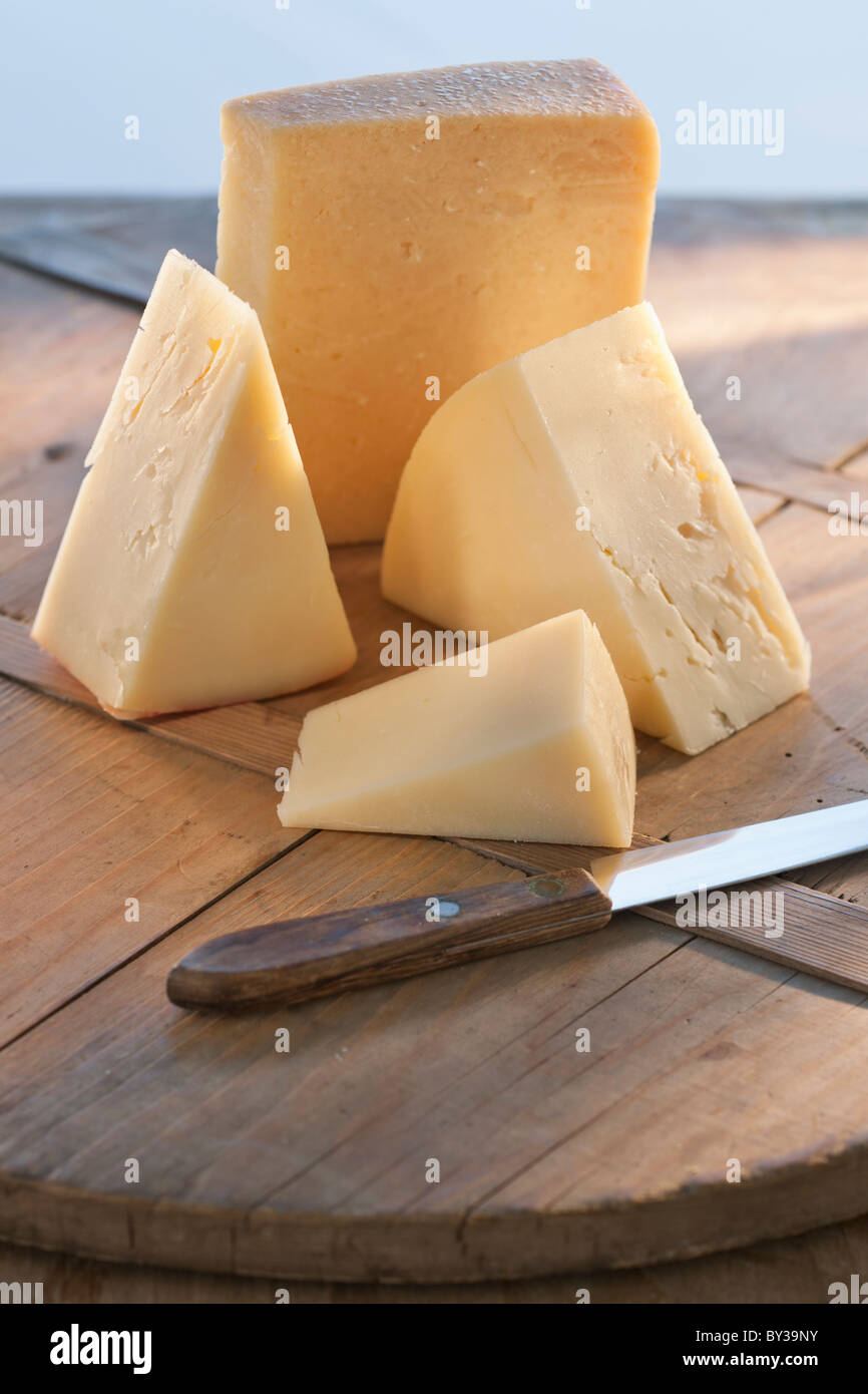 Cheese on chopping board Stock Photo - Alamy