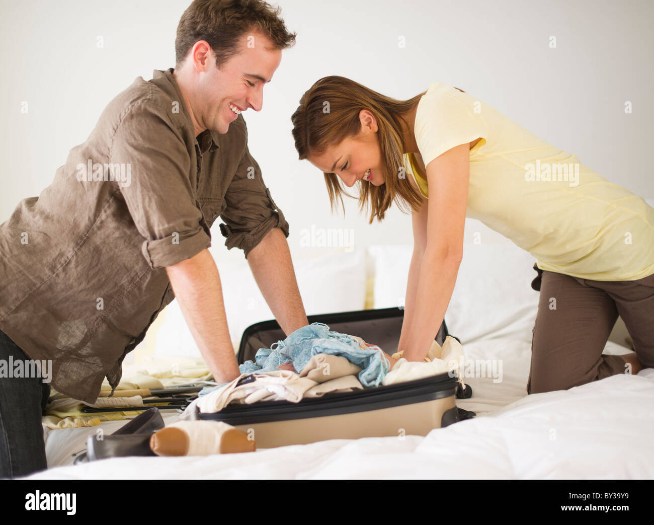 Packing luggage two men hi-res stock photography and images - Alamy