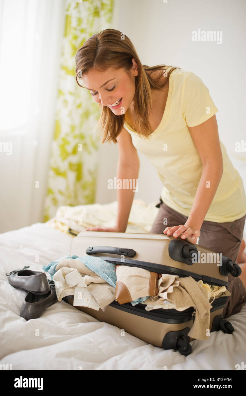 Woman packing luggage new journey hi-res stock photography and images ...
