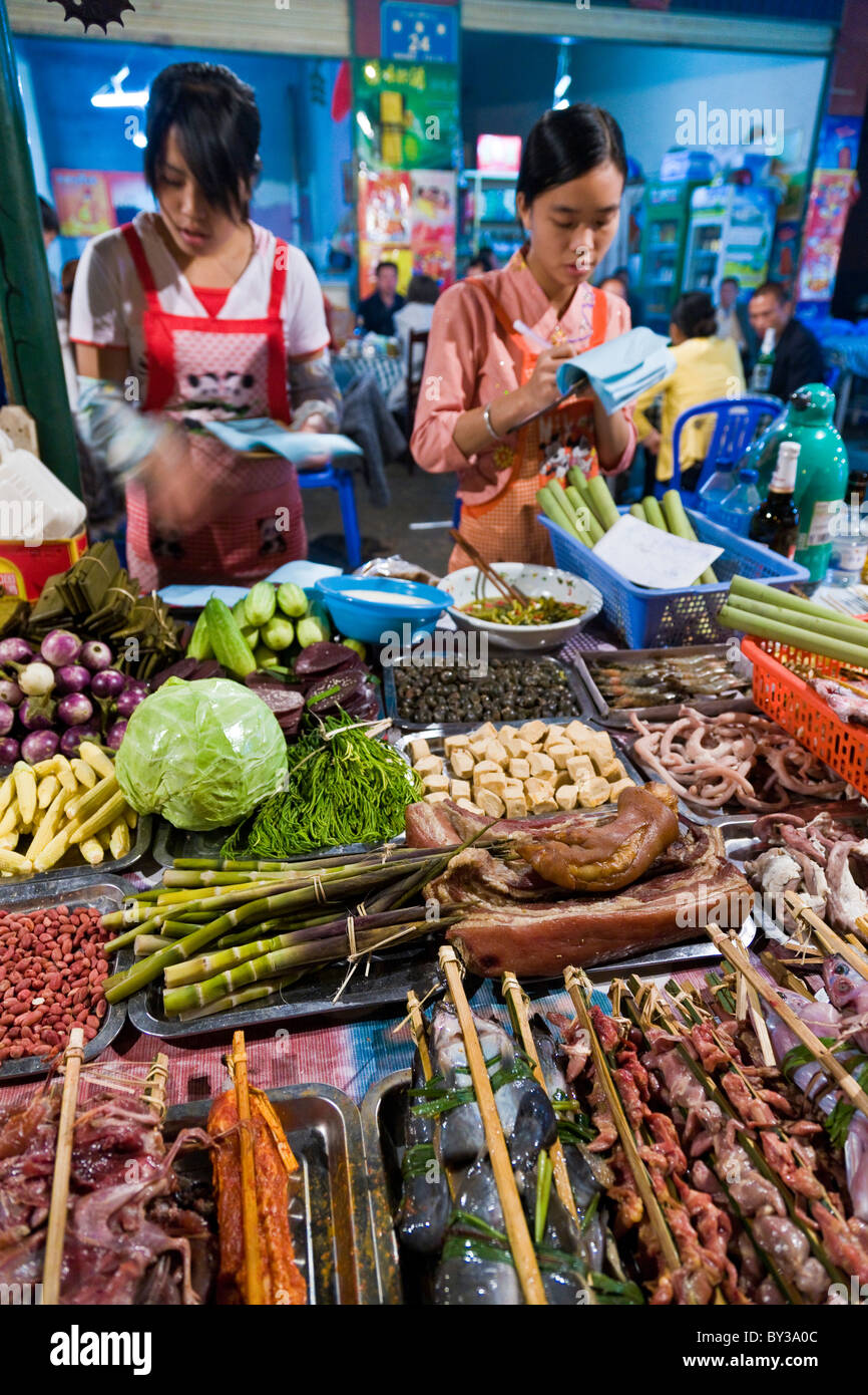 Raw food at an outdoor restaurant in Jinghong, Yunnan Province ...