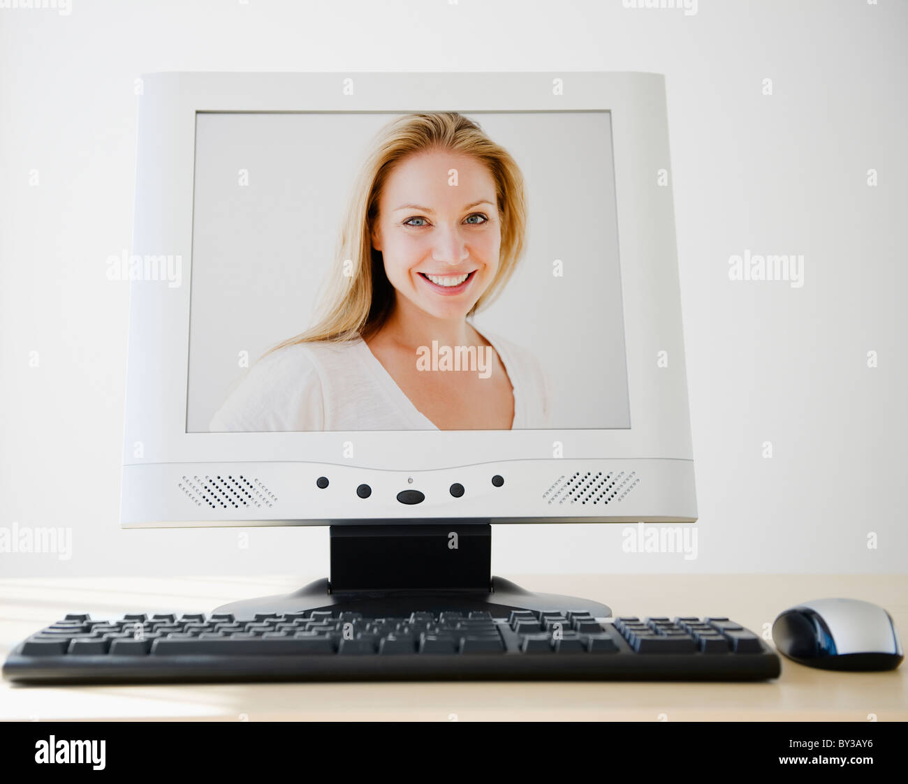 USA, New Jersey, Jersey City, PC flat screen showing attractive young ...