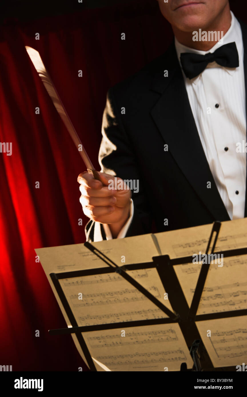 Midsection of orchestra conductor Stock Photo - Alamy