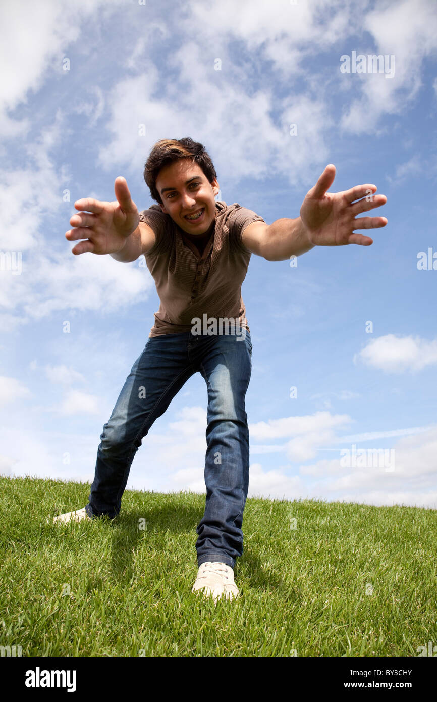 Young man giving you some help with a smiling face Stock Photo - Alamy