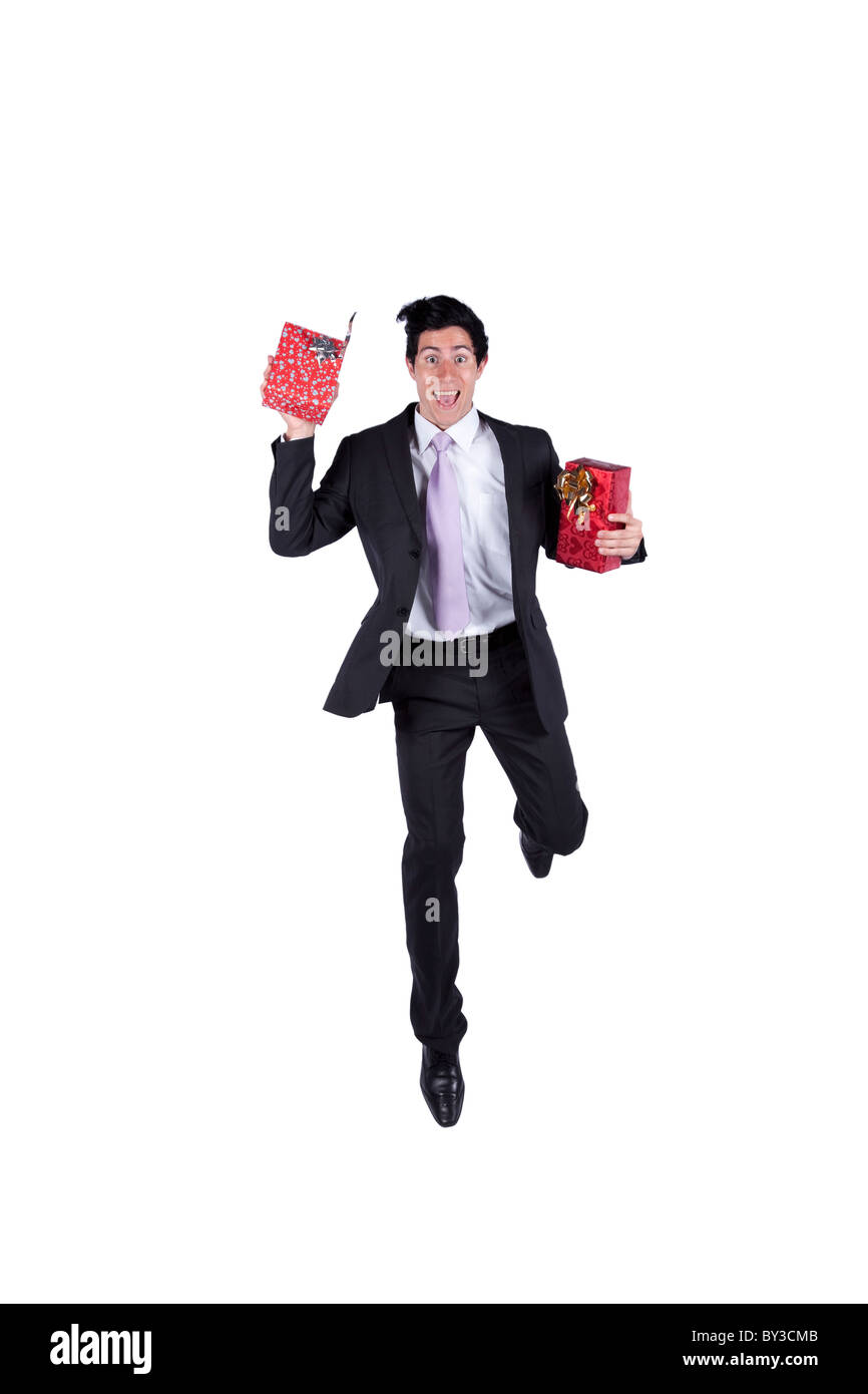 happy businessman jumping with some gift present isolated on white ...