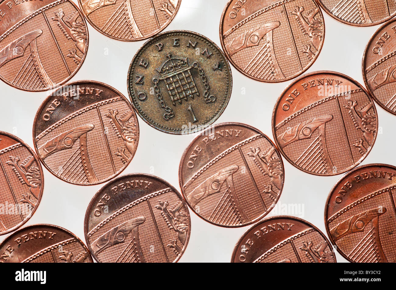 One penny is the odd-one-out Stock Photo - Alamy